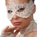 Beautiful woman with tender face in lace mask over her eyes Stock Photo ...