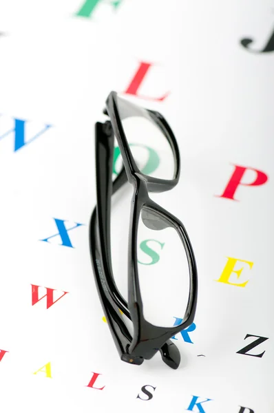 Optical reading glasses on the eyesight table — Stock Photo © Elnur ...