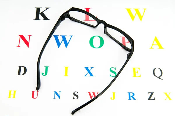 Optical reading glasses on the eyesight table — Stock Photo © Elnur ...