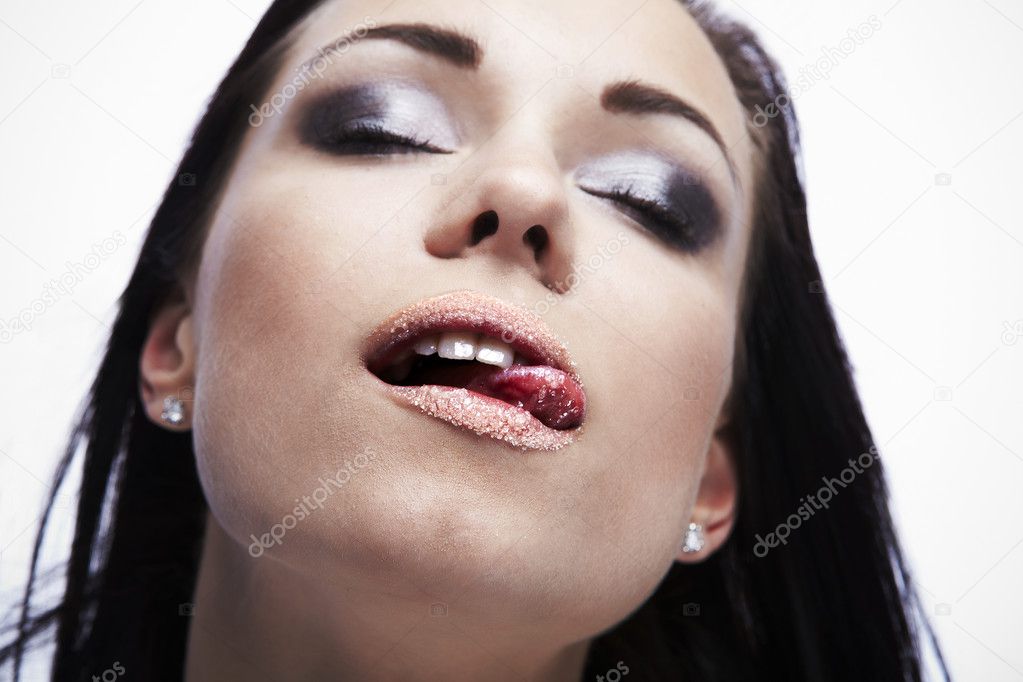 High angle view of a face of a beautiful young woman. Isolated on white ...