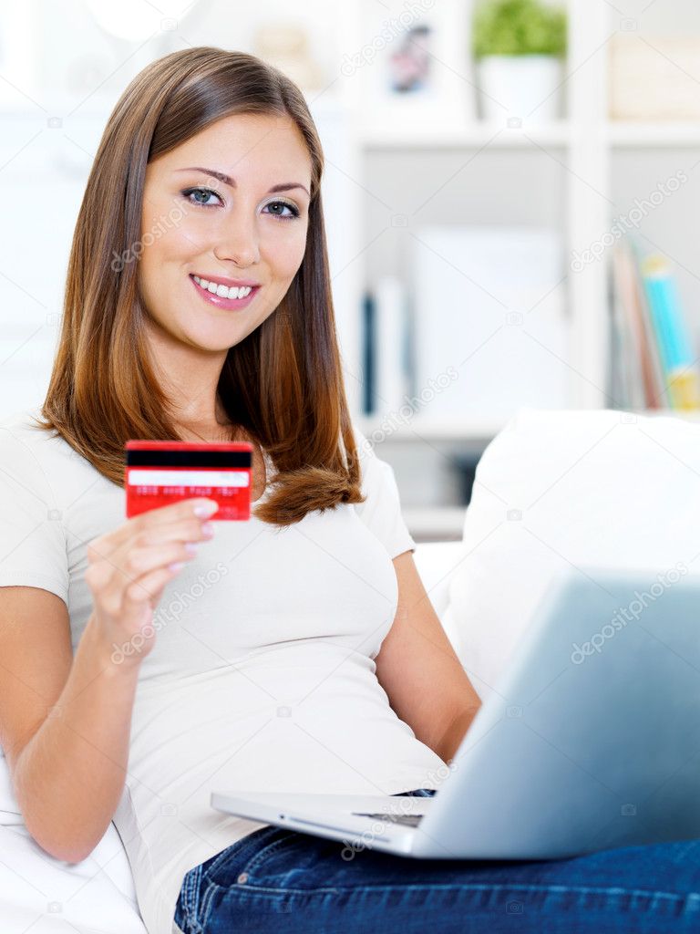 Woman holding credit card with laptop — Stock Photo © valuavitaly #4084066 Woman holding credit card with laptop — Stock Photo © valuavitaly #4084066