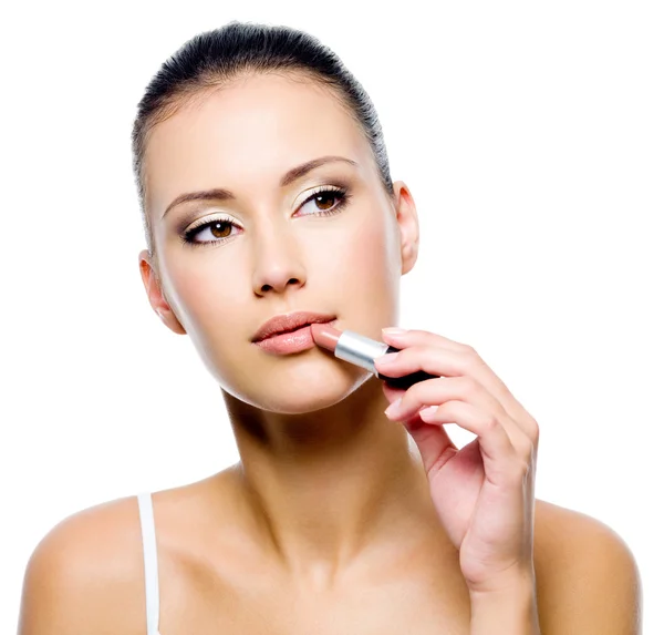 Girl applying lipstick Stock Photos, Royalty Free Girl applying ...