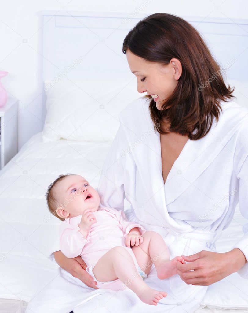 Mother holding baby and looking at him — Stock Photo © valuavitaly #4106227