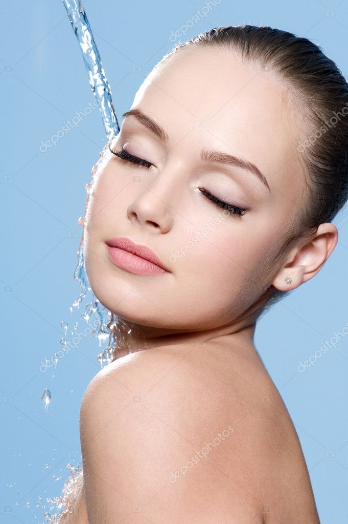 Stream of water falling on the female face — Stock Photo © valuavitaly ...