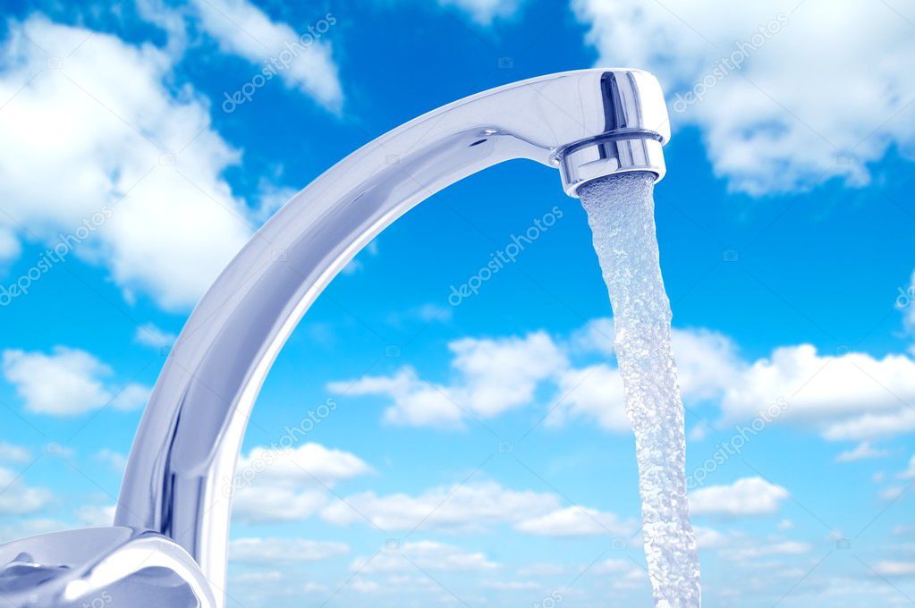 Water flowing from the faucet against the blue sky — Stock Photo ...