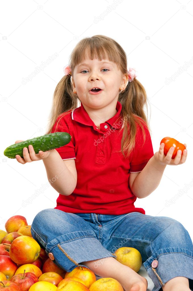 The little girl with fruit and vegetables isolated on white back Stock ...