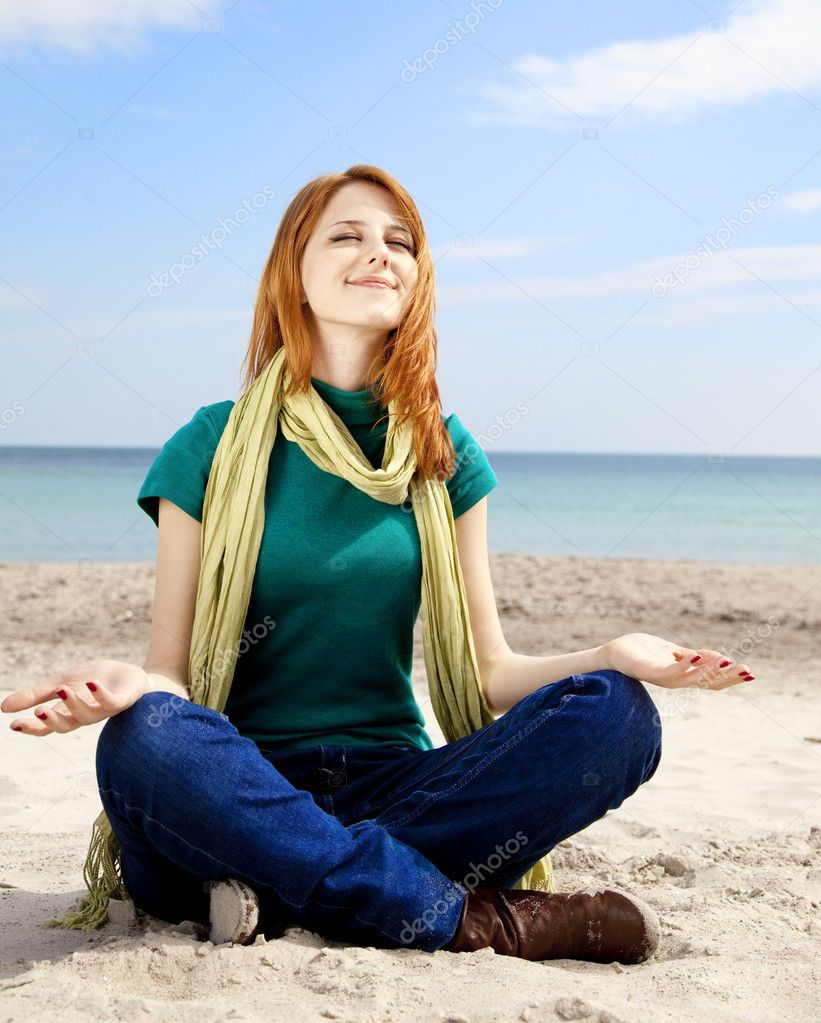 Young Beautiful Red Haired Girl At The Beach In Spring Time Stock