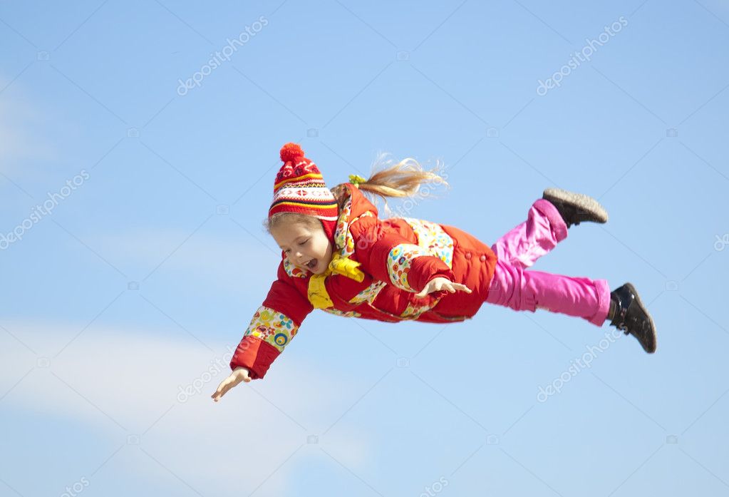 Little girl fly in the sky. — Stock Photo © massonforstock #5280975