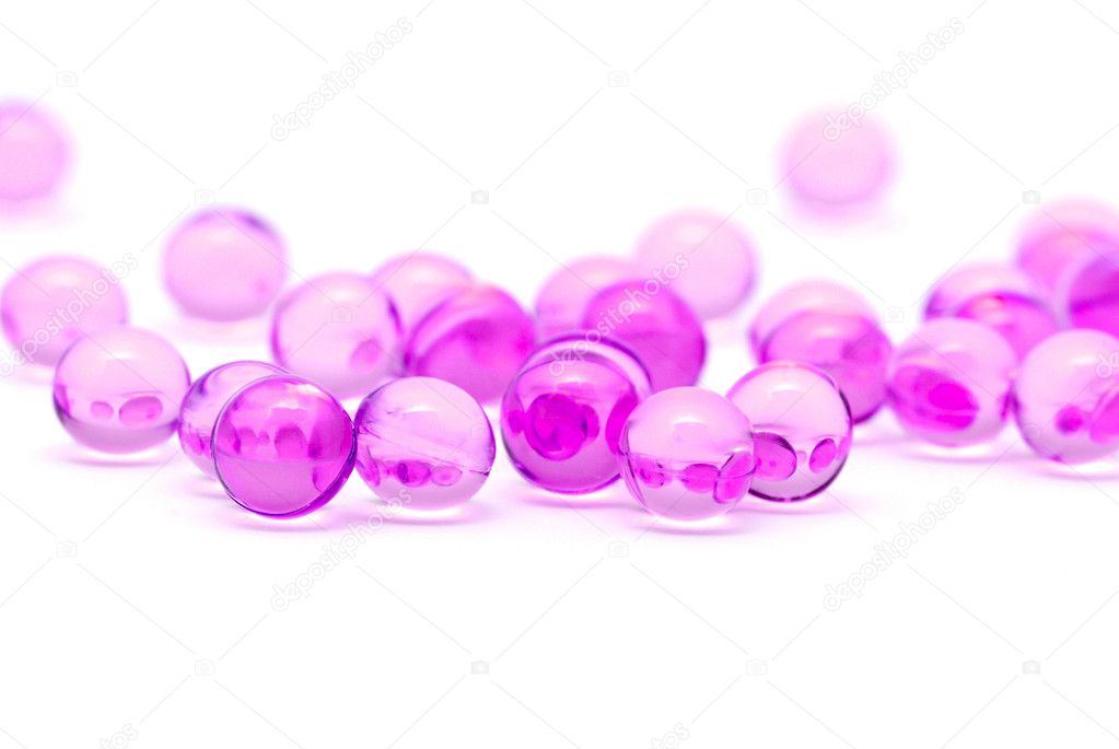 Transparent purple capsules — Stock Photo © Olinka #4338263