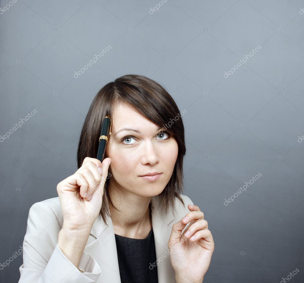Woman holding a pen — Stock Photo © Karuka #4647414 Woman holding a pen — Stock Photo © Karuka #4647414
