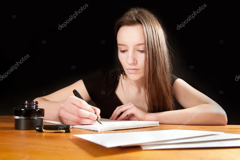 Pretty young woman writing a letter — Stock Photo © deposit123 #4808815