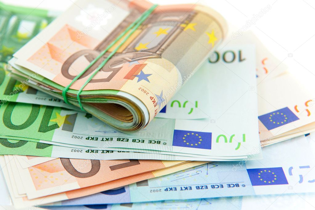 Rolled with rubber euro notes on white background Stock Photo by ...