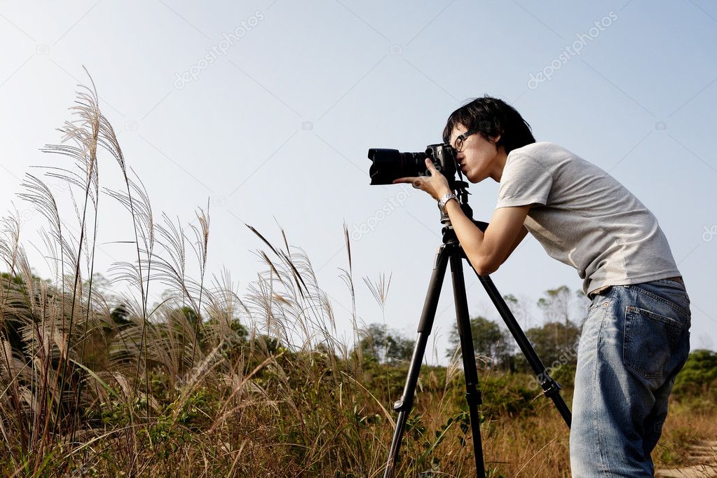 Photographer taking photo — Stock Photo © leungchopan #4421528