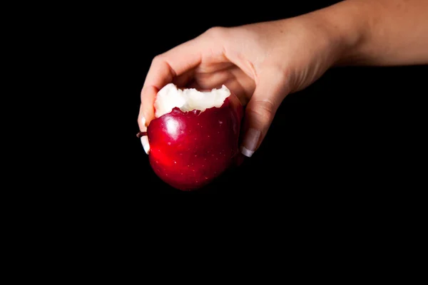Woman hand giving an apple to man on black background — Stock Photo ...