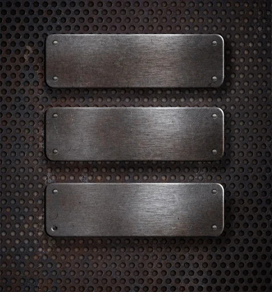 Four metal plates over grid background — Stock Photo © Andrey_Kuzmin ...