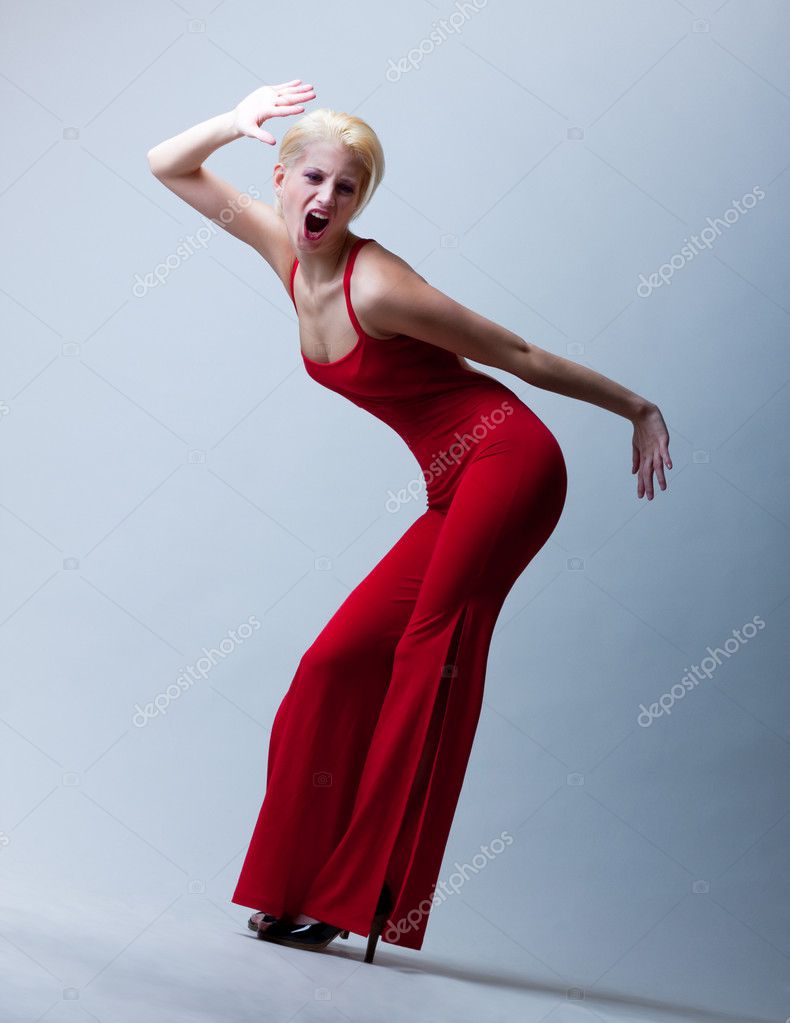 Attractive screaming girl in red dress — Stock Photo © fotoduki #4525348