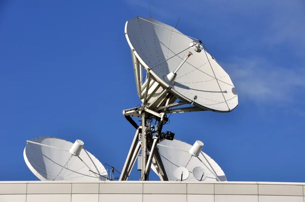Satellite Communications Dishes on top of TV Station — Stock Photo ...