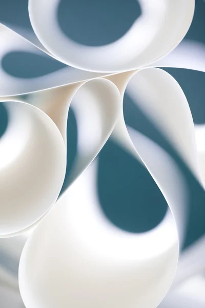 Macro background picture white curved and twisted sheet of paper ...