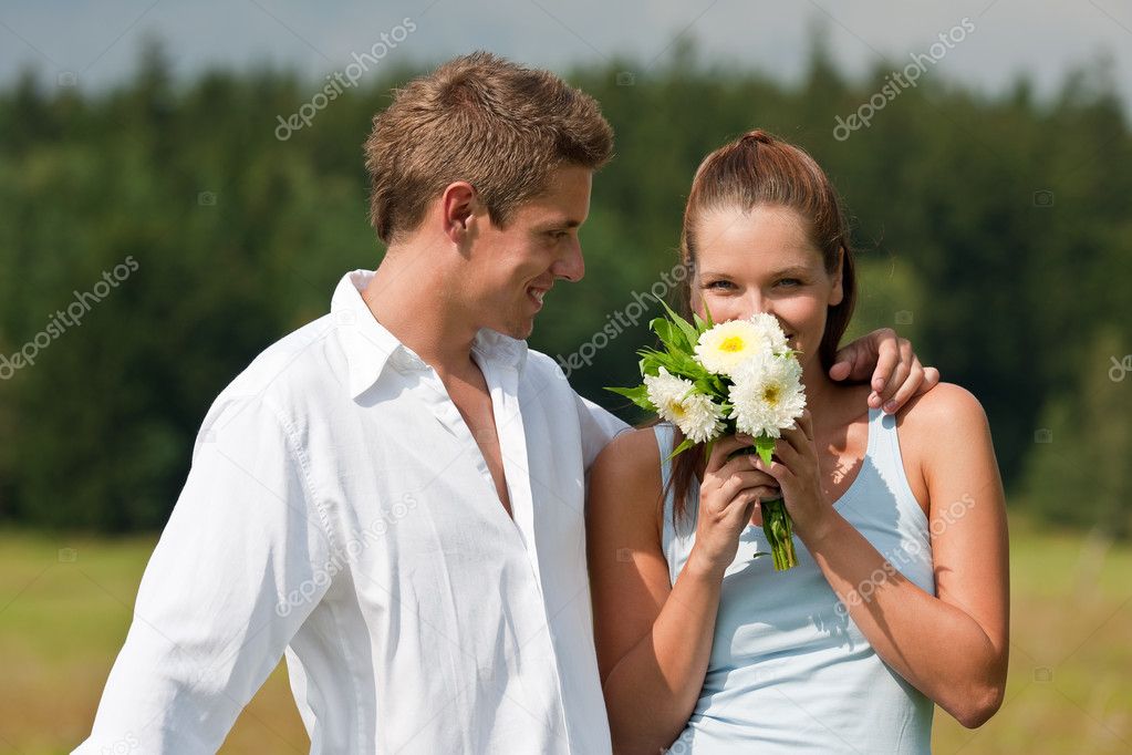 Romantic couple with flower in spring Stock Photo by ©CandyBoxImages ...