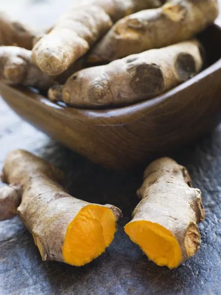 Pieces of Whole And Cracked Fresh Turmeric Root - Stock Image - Everypixel