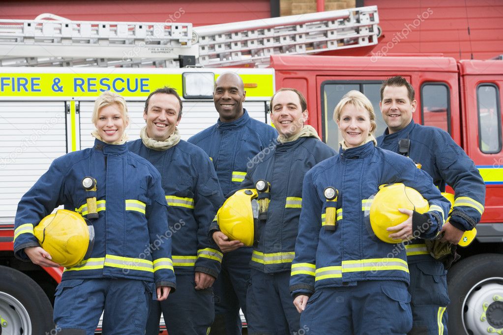 Portrait of a group of firefighters by a fire engine — Stock Photo ...