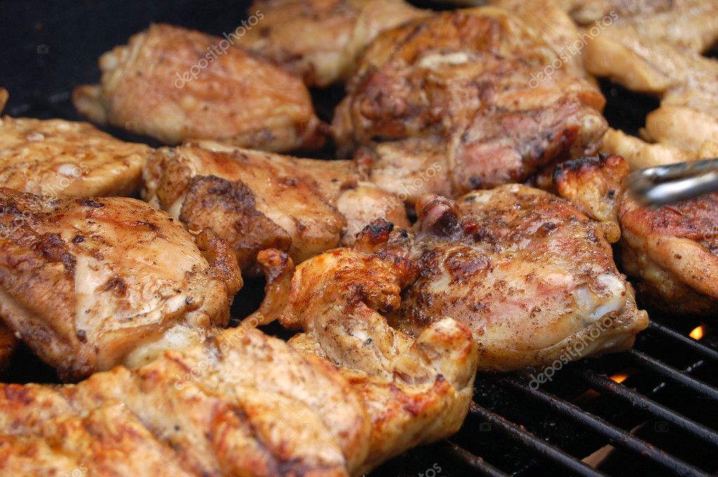 Chicken roasting on grill with fire Stock Photo by ©vlue 4623931