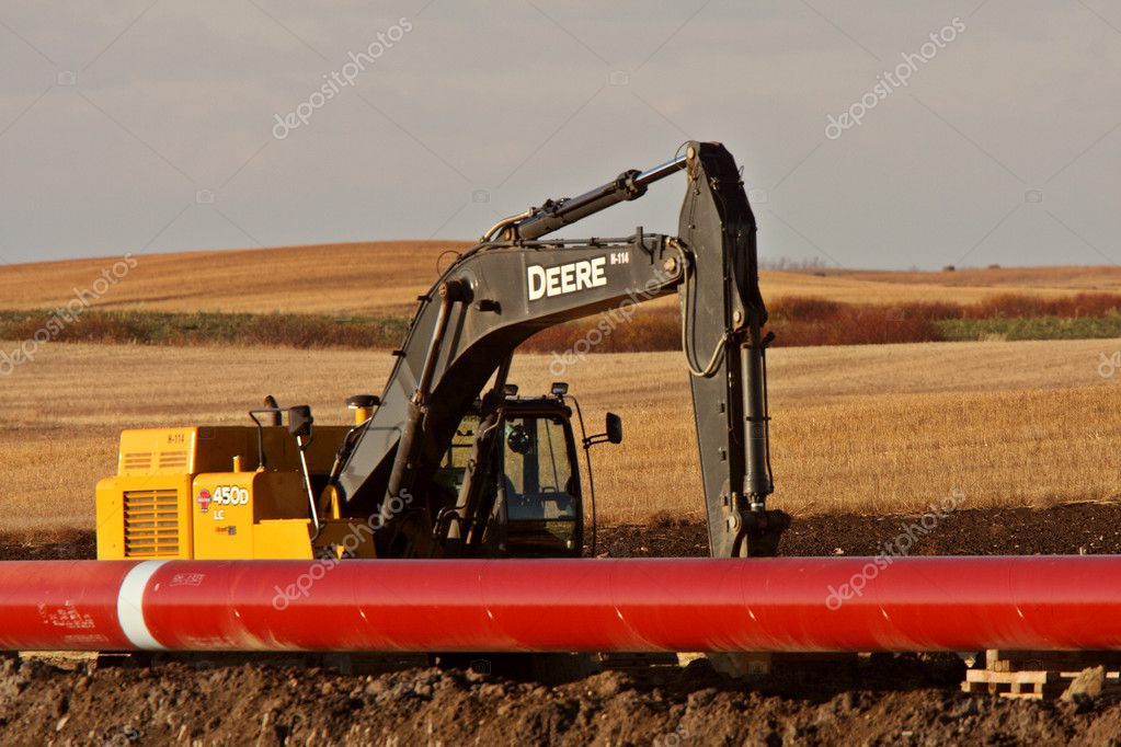 Tracked hoe laying pipes for Natural Gas Pipeline — Stock Photo ...