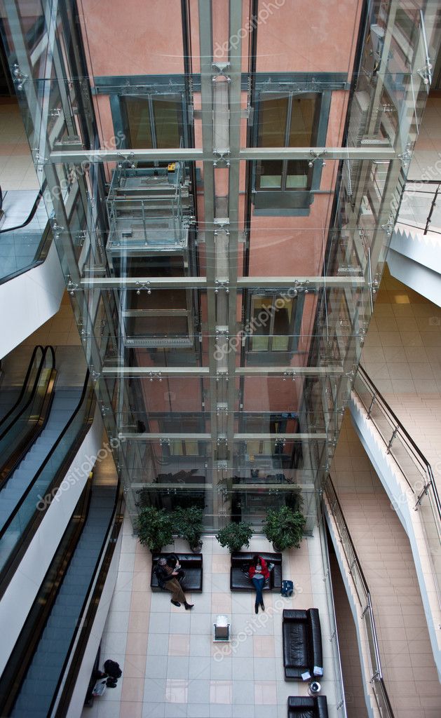 Glass elevator shaft in a modern office building — Stock Photo © vlarub ...
