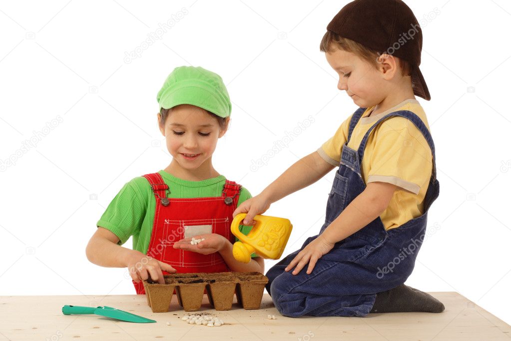 Little children plant seeds — Stock Photo © sbworld7 #4978288