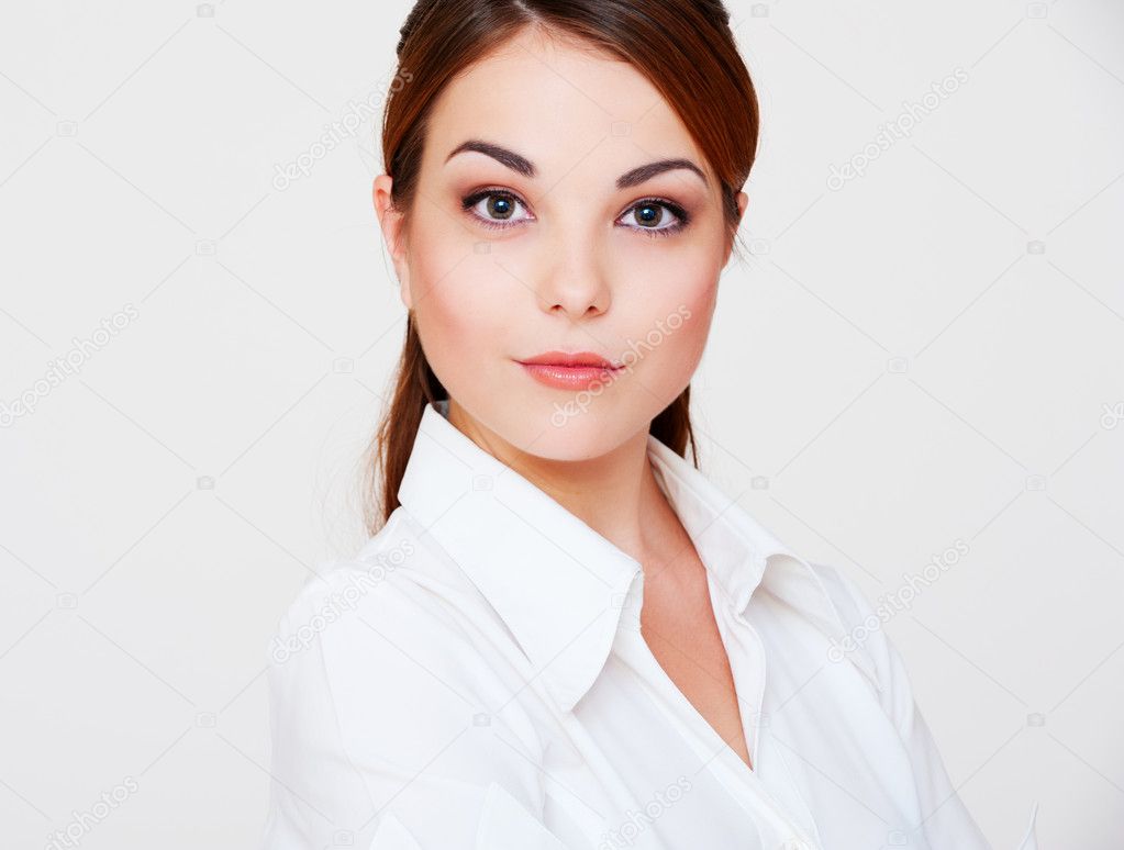 Lovely serious woman in white shirt — Stock Photo © konstantynov #5181939 Lovely serious woman in white shirt — Stock Photo © konstantynov #5181939